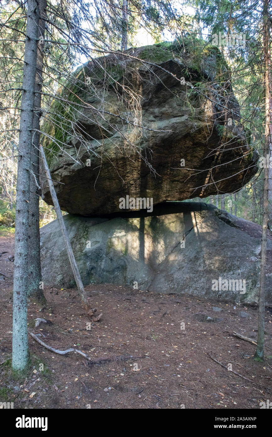Kummakivi, balancing boulder on bedrock in Ruokolahti Finland Stock ...