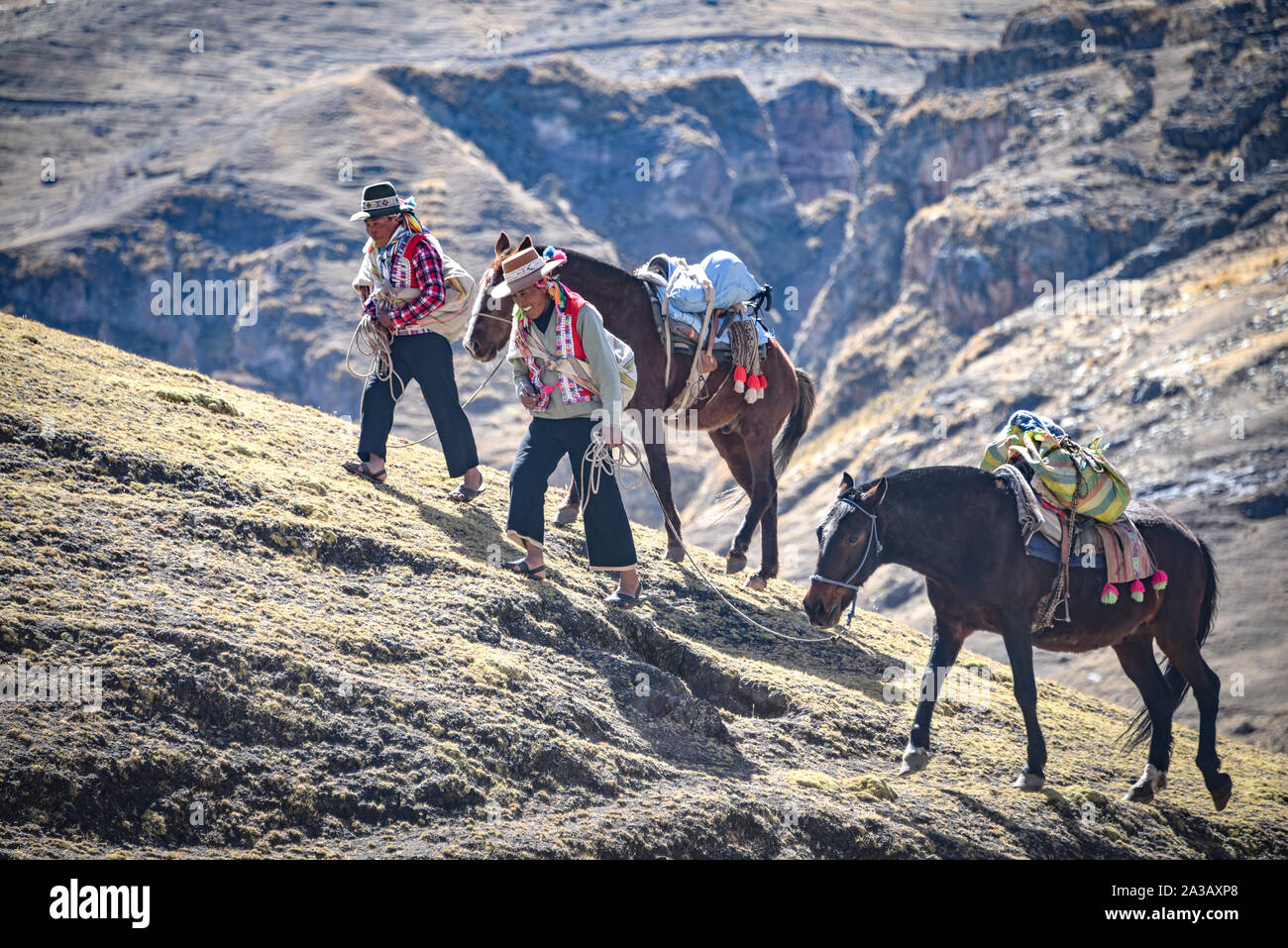 Horsemen in traditional Quechua dress following trails through the ...