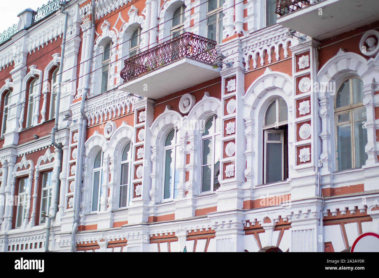 Fragment of a house with old baroque windows Stock Photo - Alamy
