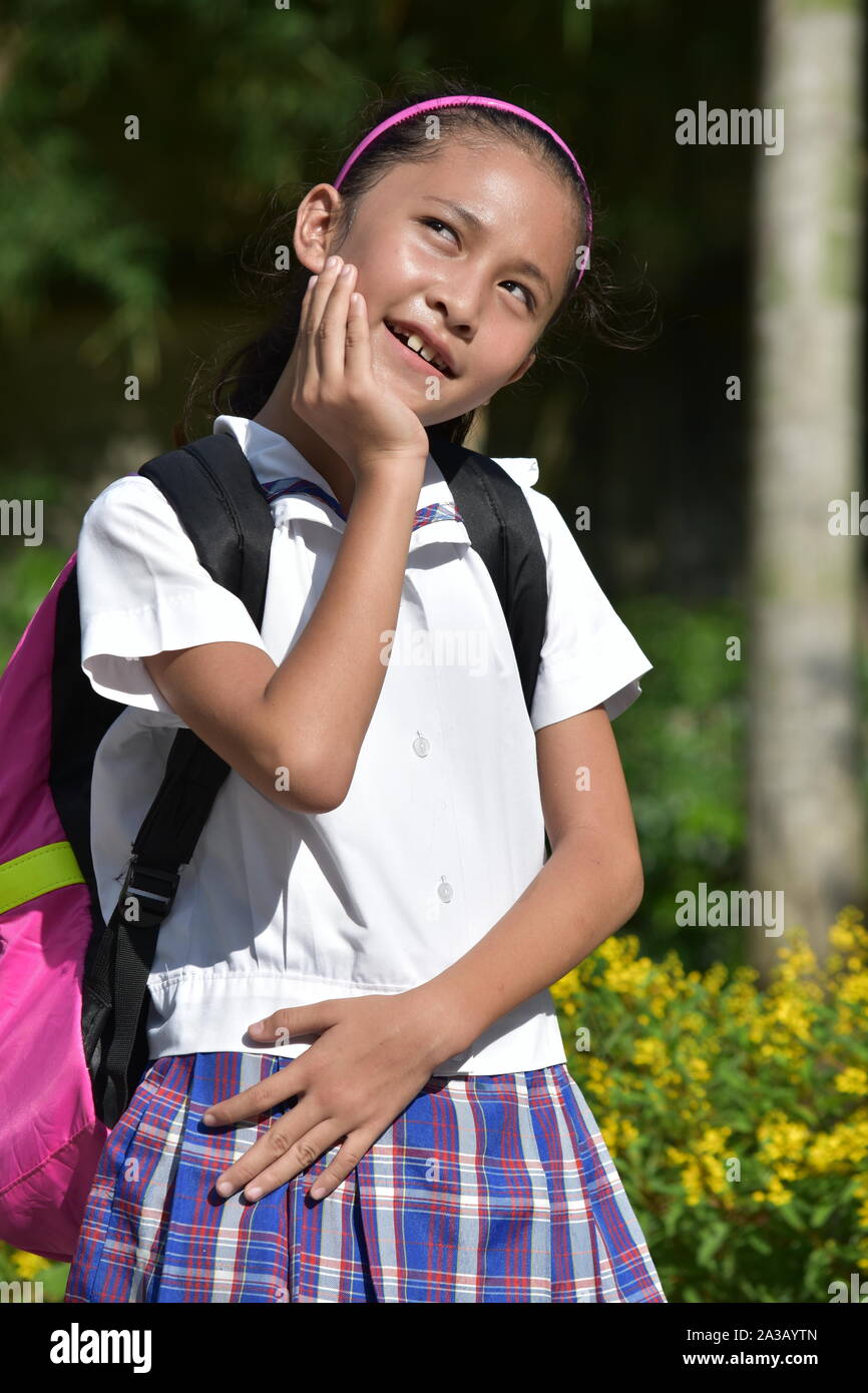 A Girl Student Wondering With Books Stock Photo - Alamy