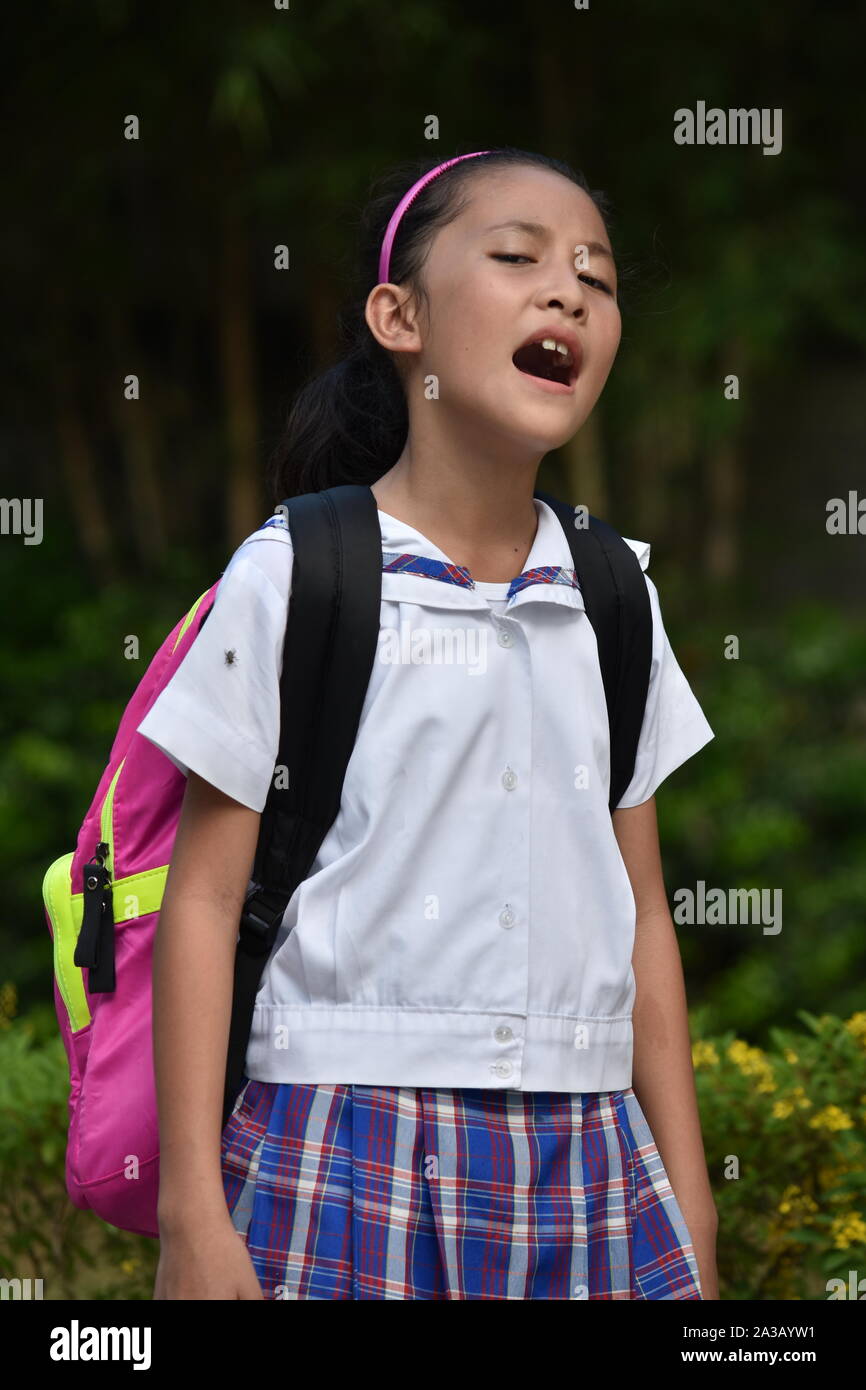 A Stressed School Girl With Books Stock Photo - Alamy