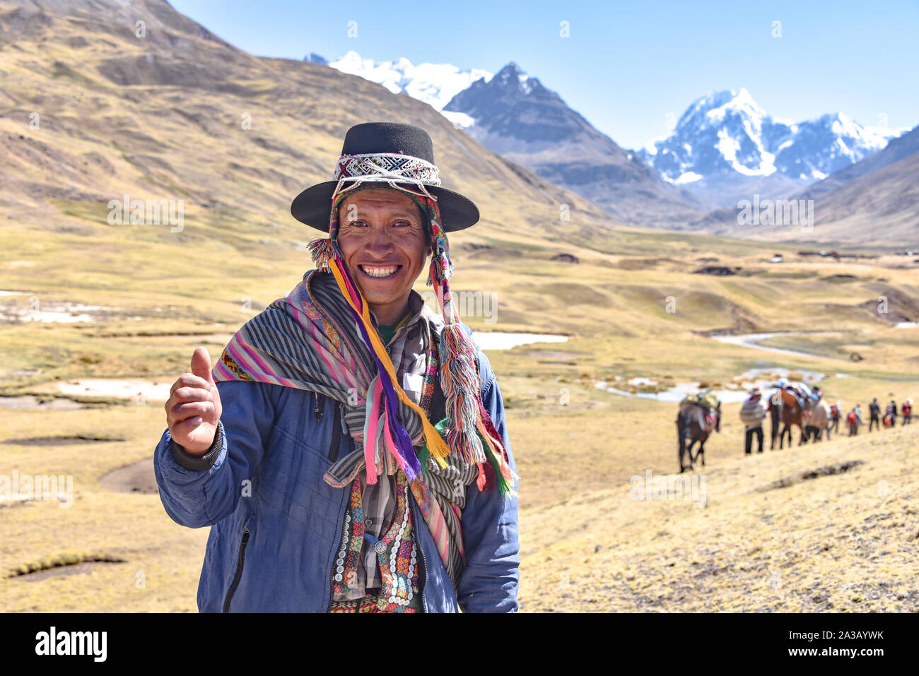 Horsemen in traditional Quechua dress following trails through the ...
