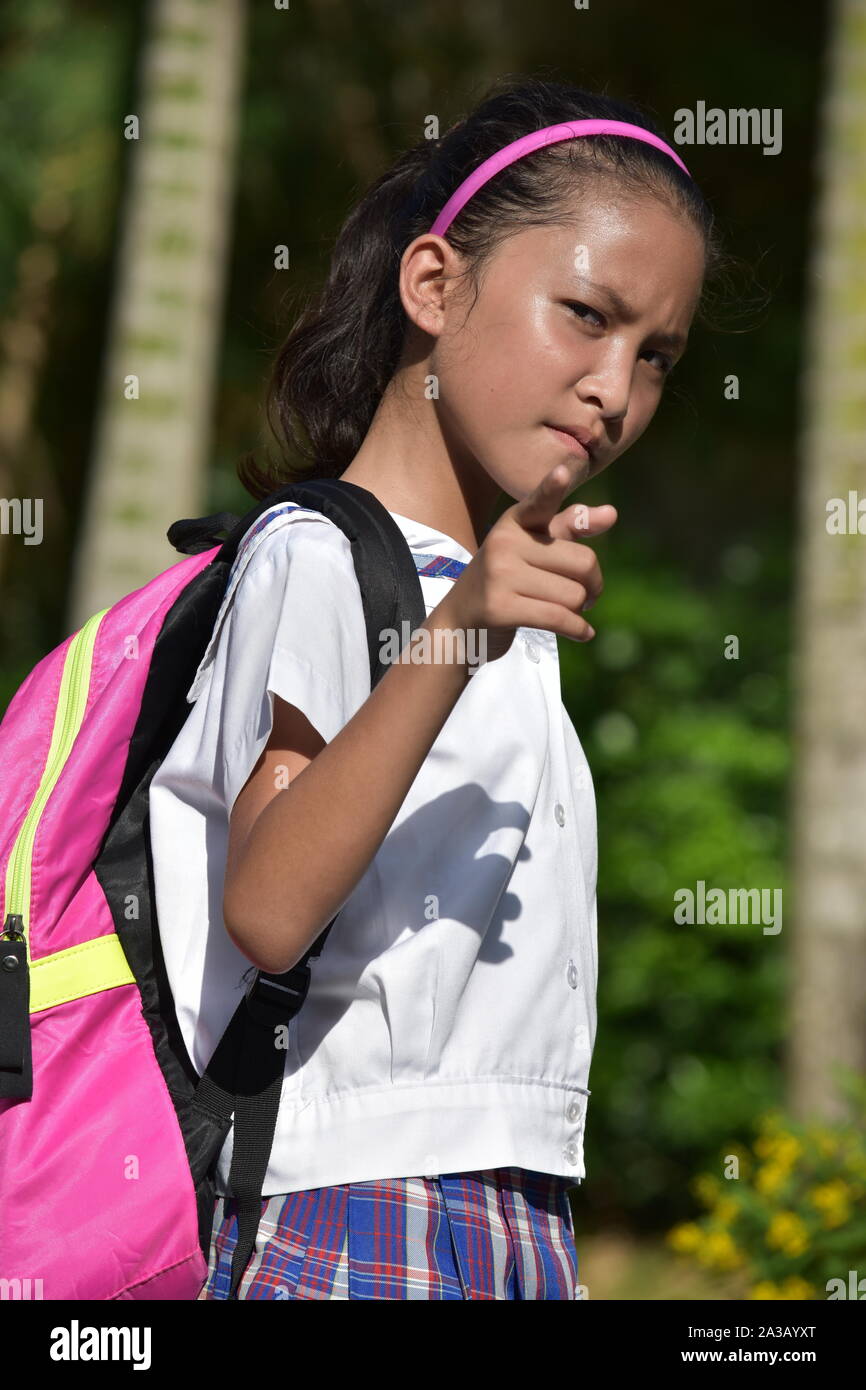 A Girl Student Pointing With Notebooks Stock Photo - Alamy