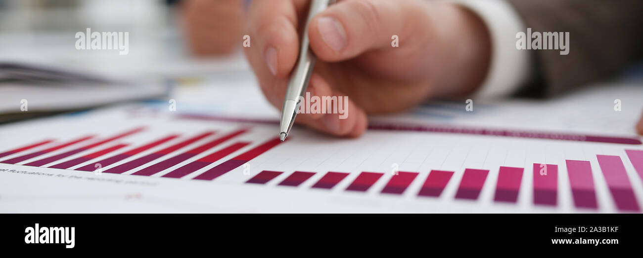 Group of people deliberate on problem with infographics Stock Photo - Alamy