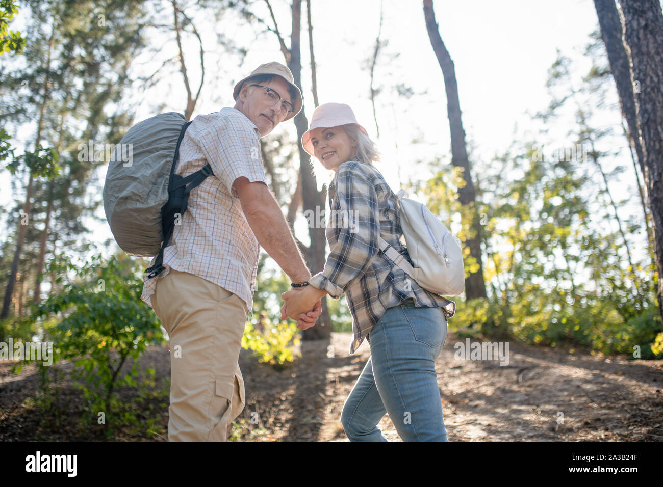 Hiking wearing backpacks hi-res stock photography and images - Alamy
