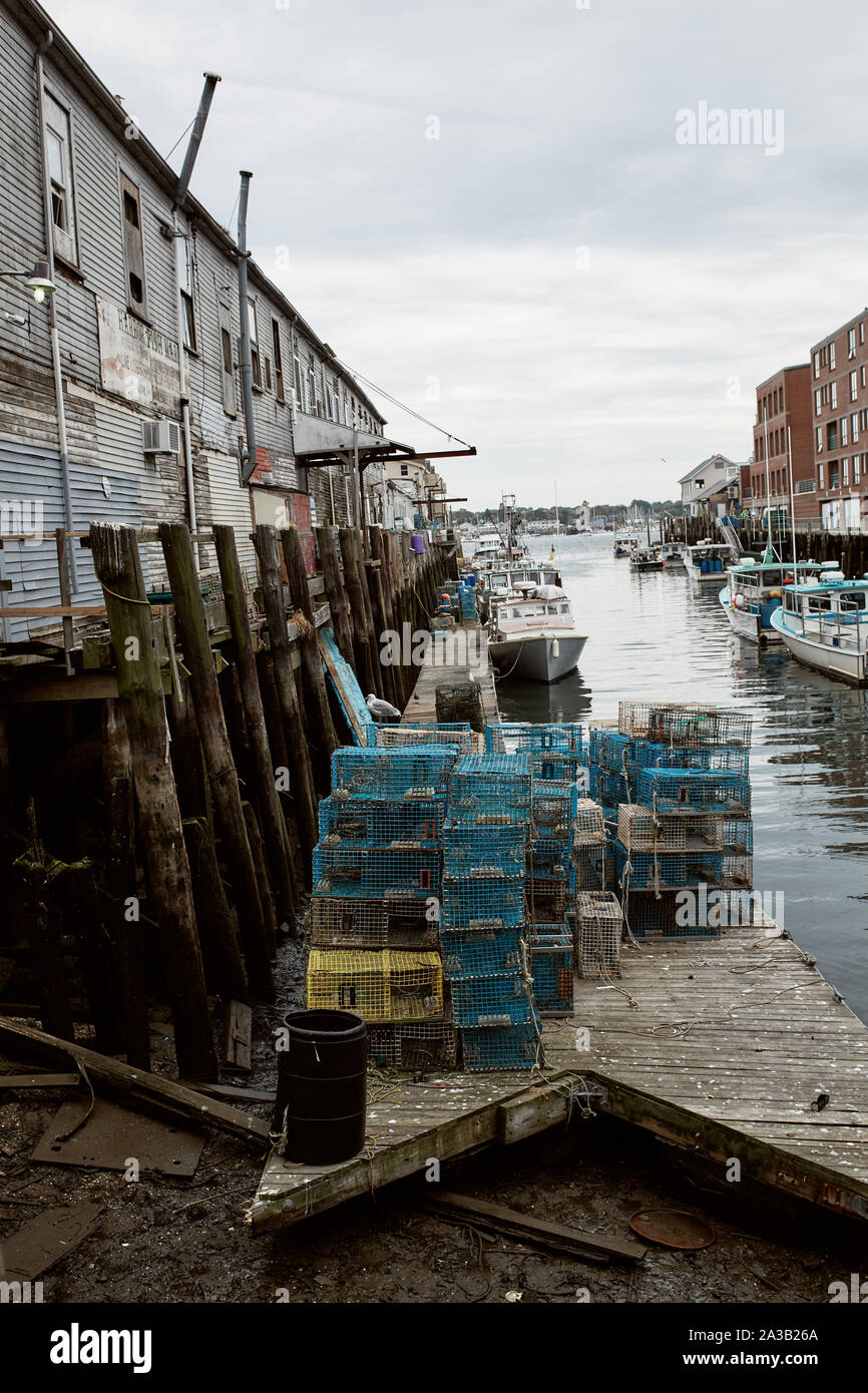 Commercial fishing wharf with stacks of lobster traps in the Old Port ...