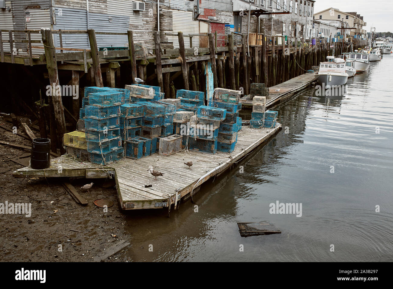 Commercial fishing wharf with stacks of lobster traps in the Old Port ...