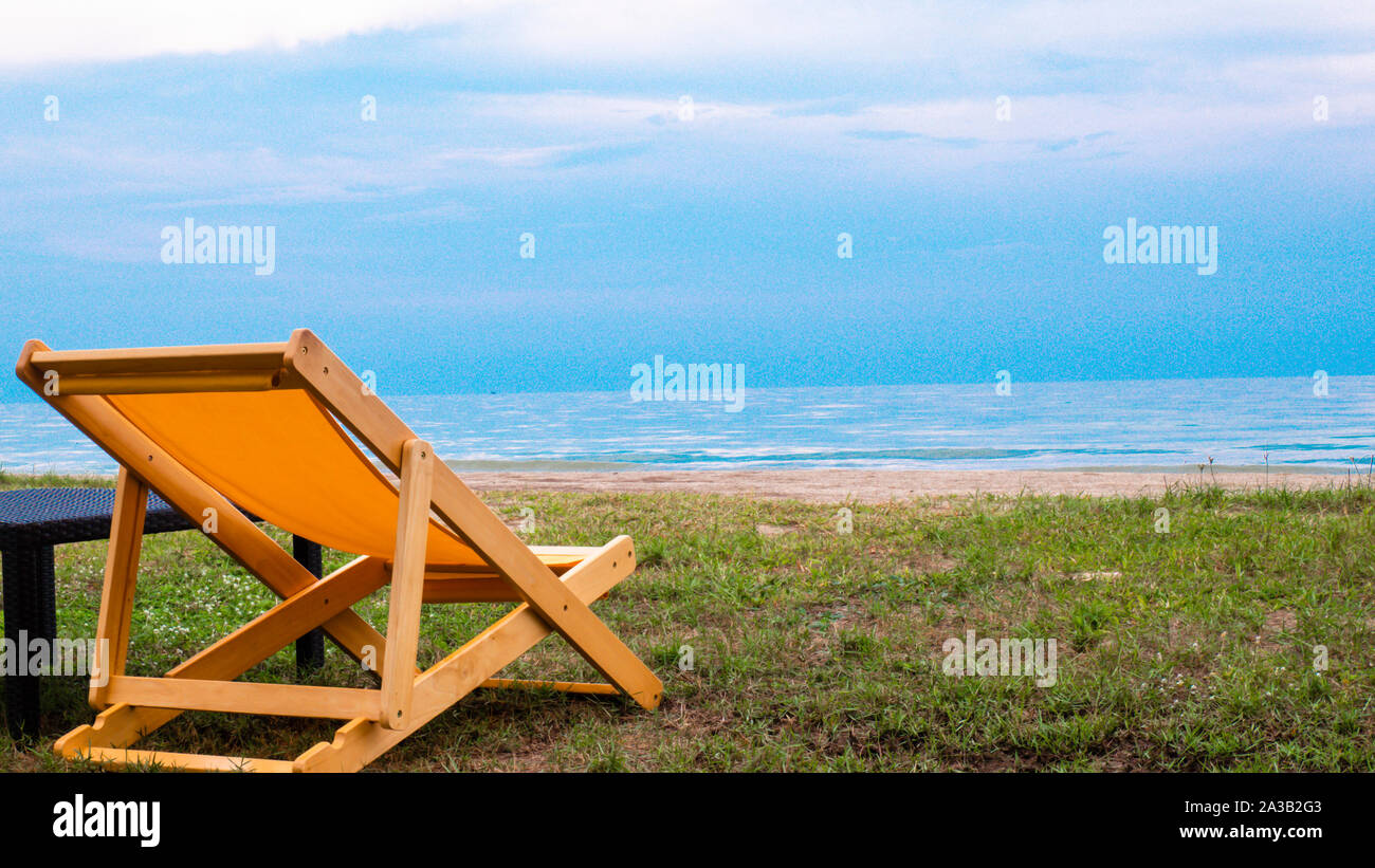 Empty deck chair .Beautiful color chairs on the beach. Blue sky relax ...