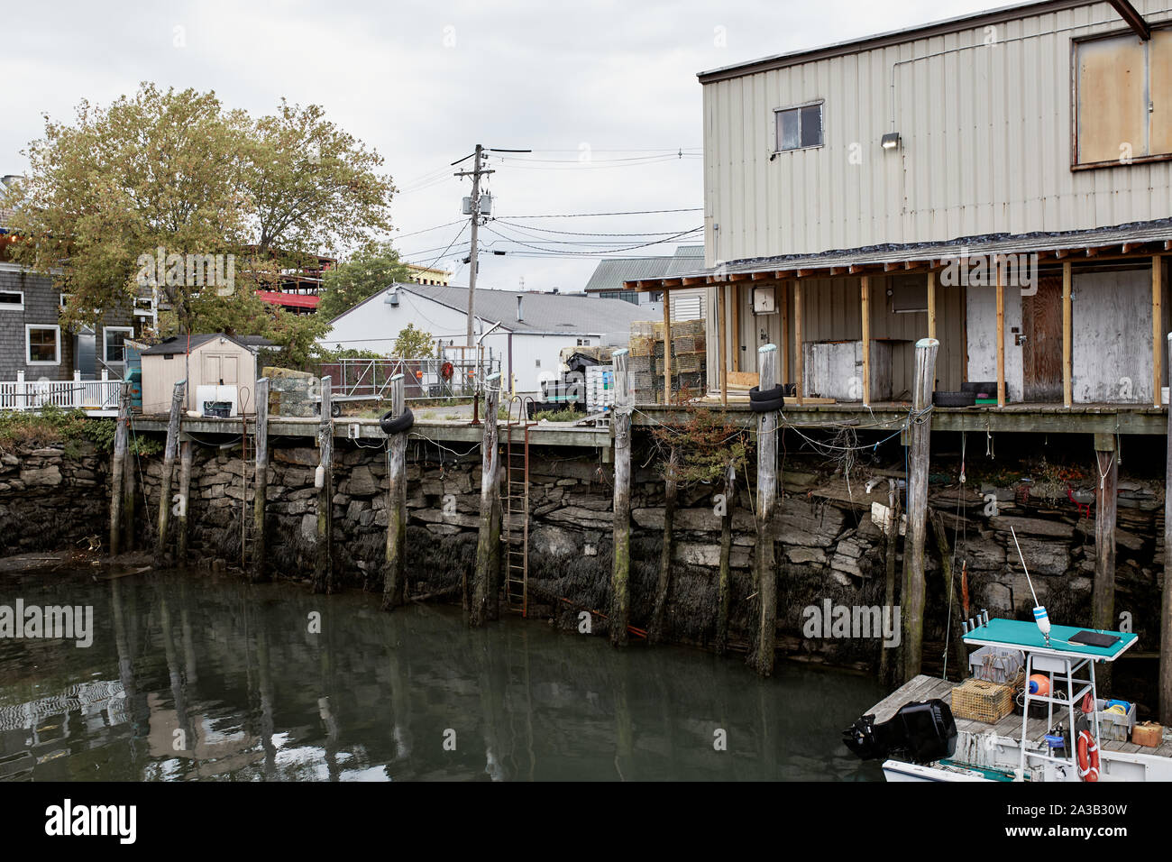 Commercial fishing wharf with stacks of lobster traps in the Old Port ...
