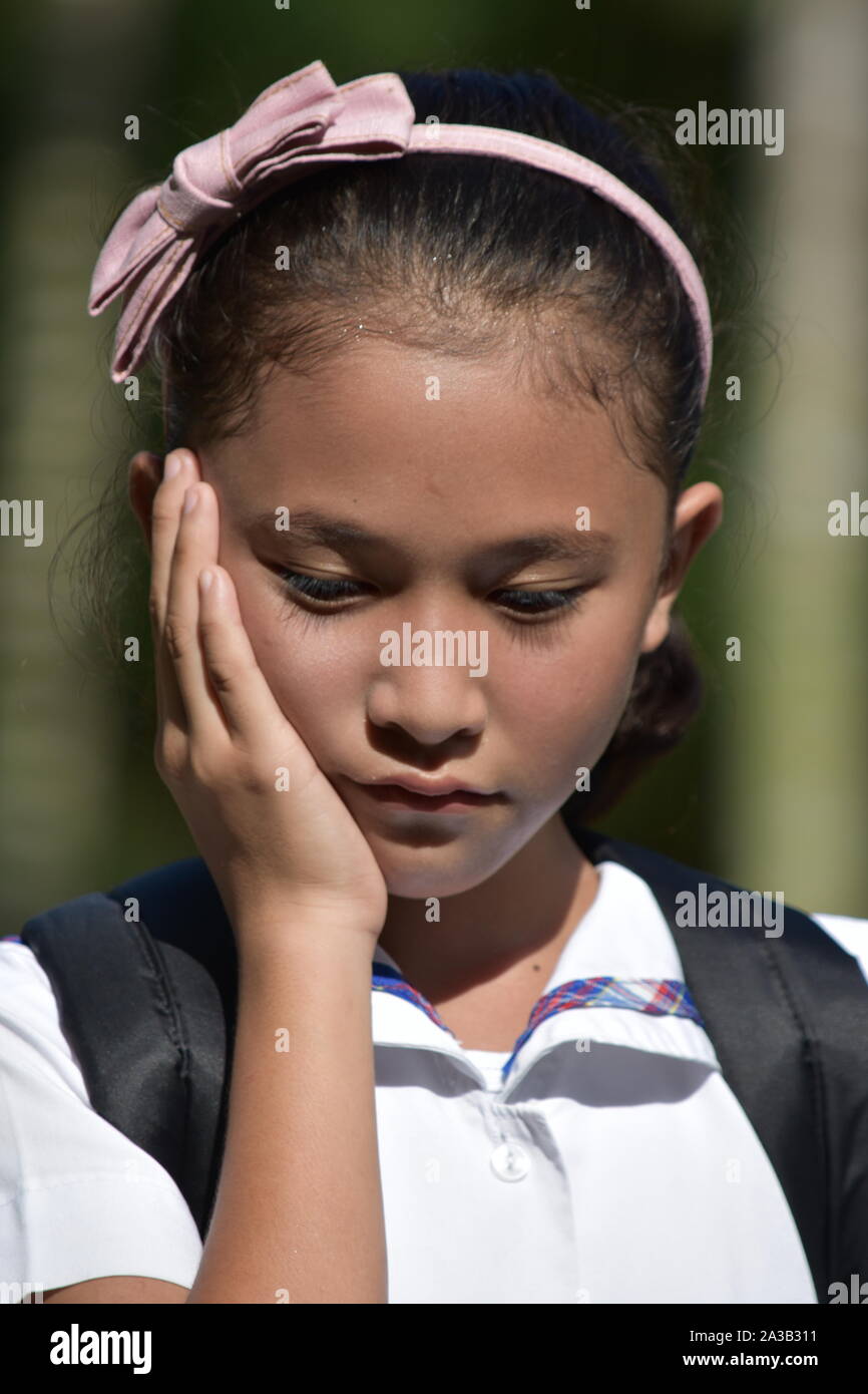 Female Student And Sadness With Books Stock Photo - Alamy