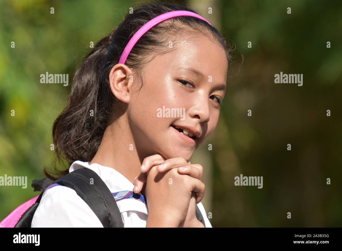 Pretty Asian Girl Student Praying With Notebooks Stock Photo - Alamy
