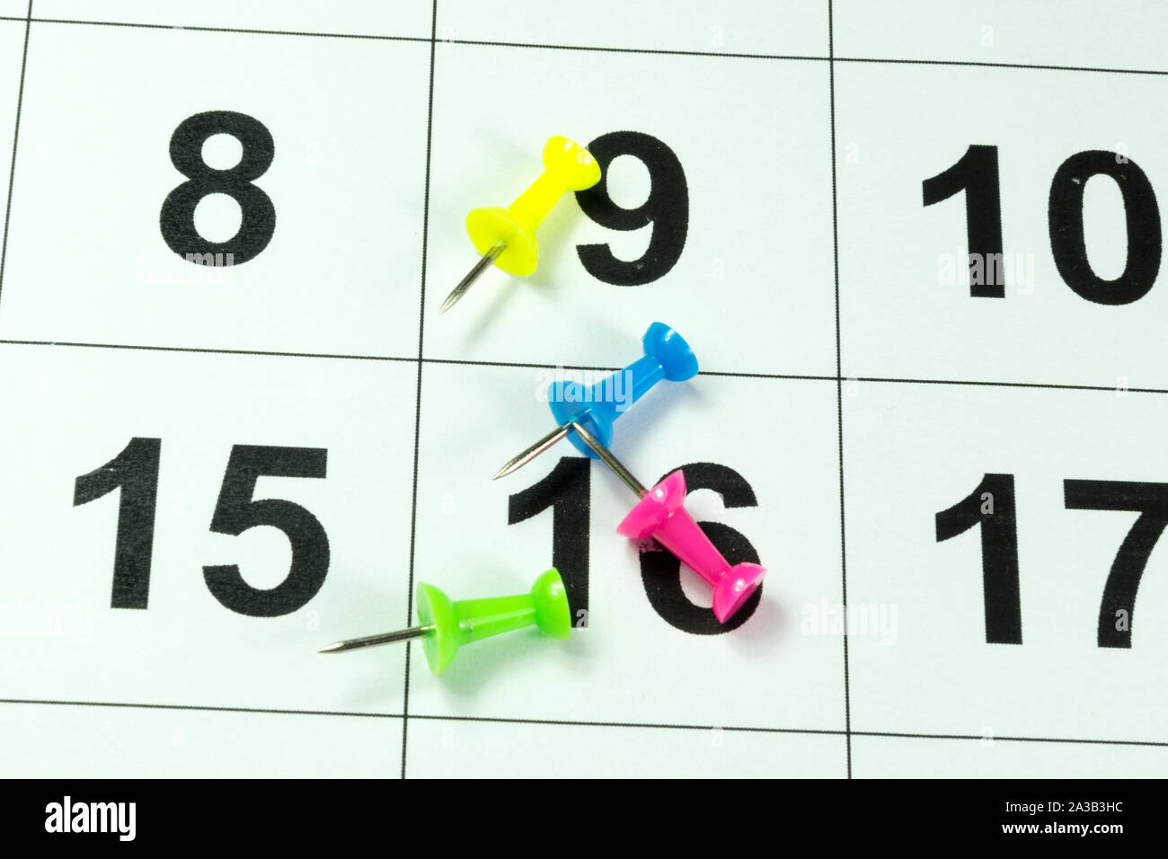 Tacks and a calendar Stock Photo - Alamy