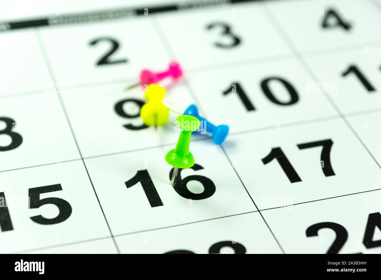 Tacks and a calendar Stock Photo - Alamy