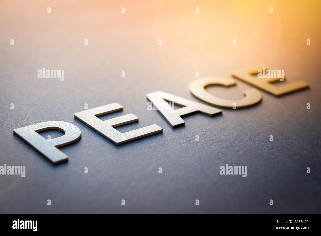 Word peace written with white solid letters on a board Stock Photo - Alamy