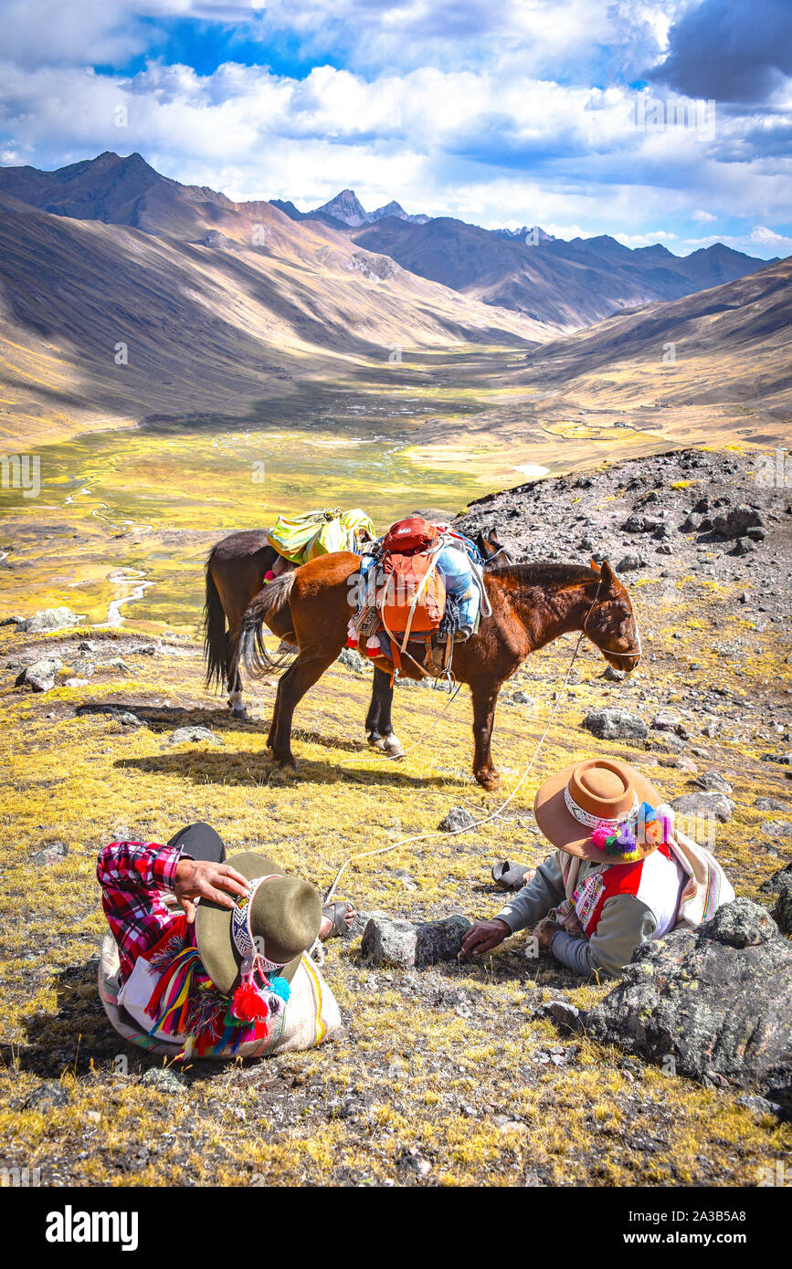 Horsemen in traditional Quechua dress following trails through the ...