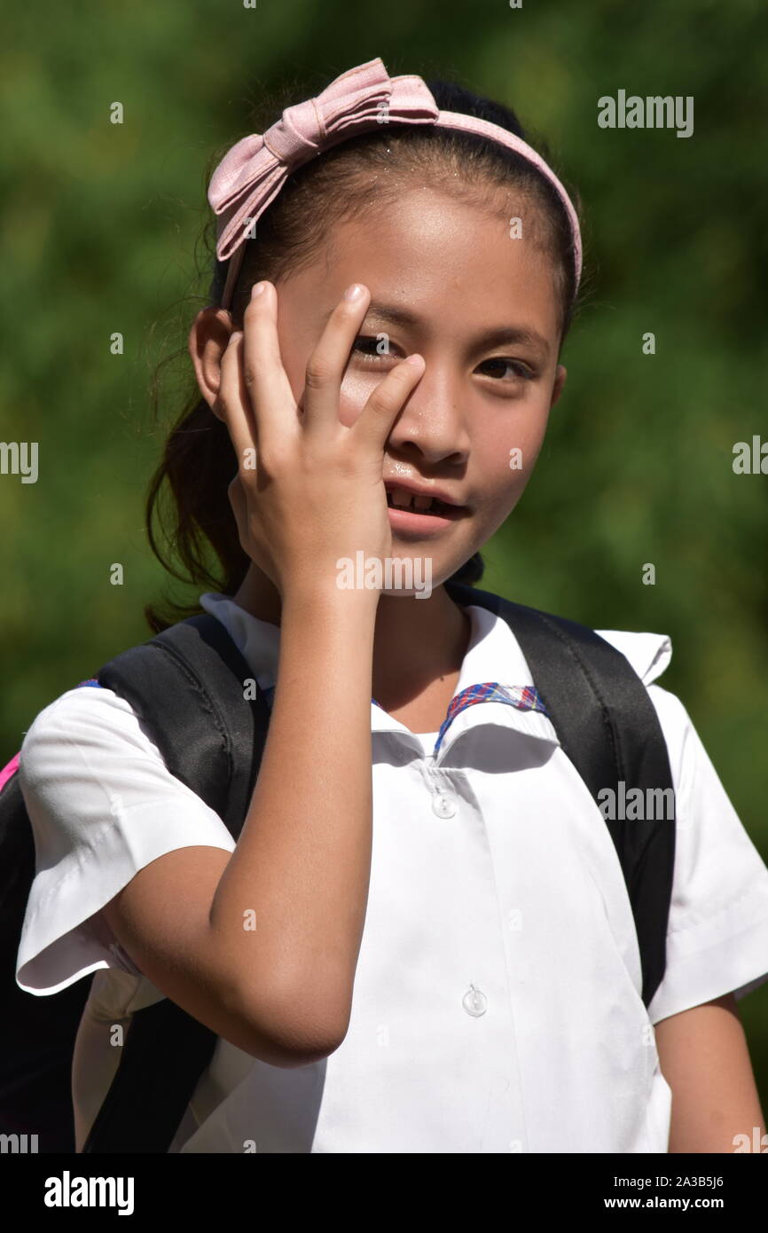 A Forgetful Diverse Person With Books Stock Photo - Alamy