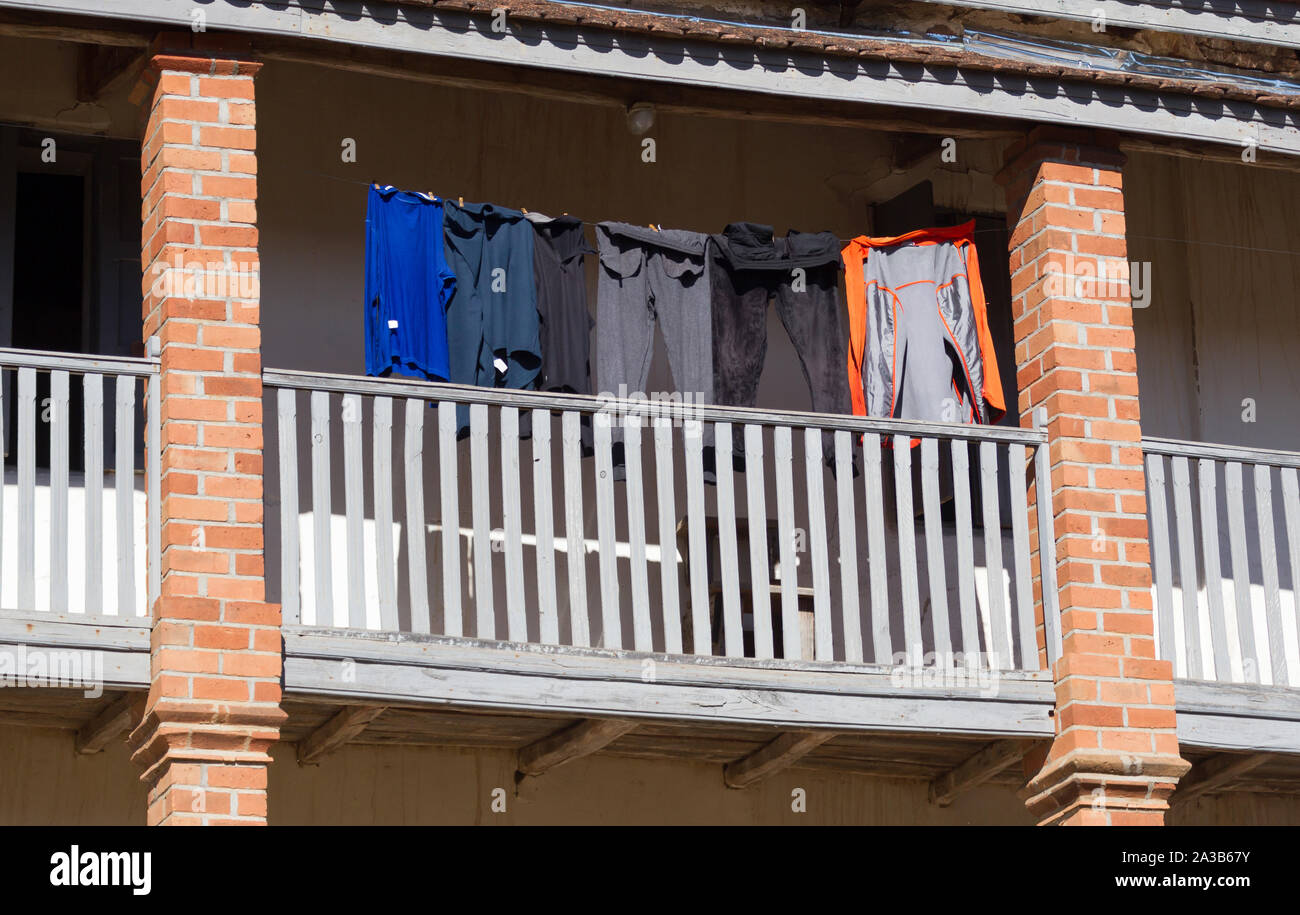 Clothes drying on a balcony, old house Stock Photo - Alamy