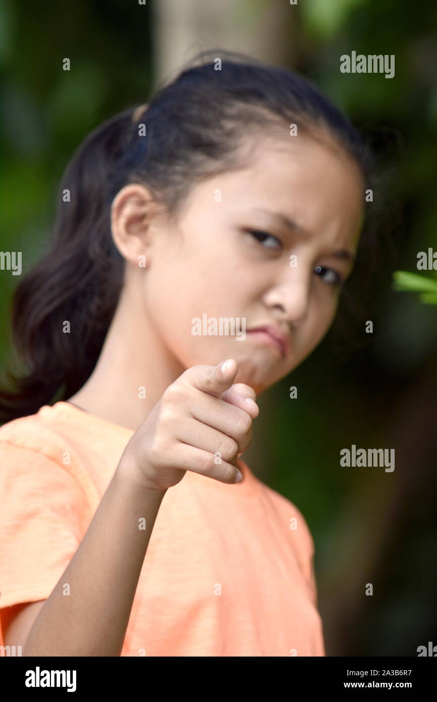 A Cute Female Youngster Pointing Stock Photo - Alamy