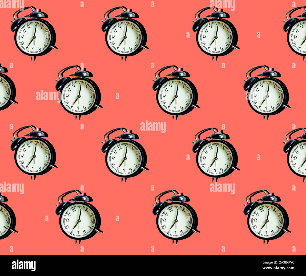Vintage alarm clock on a pink minimal background. Time management and ...