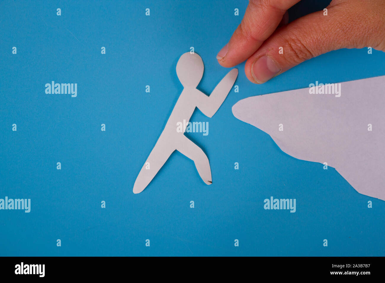 Helping hand concept. Paper people helping each other Stock Photo - Alamy