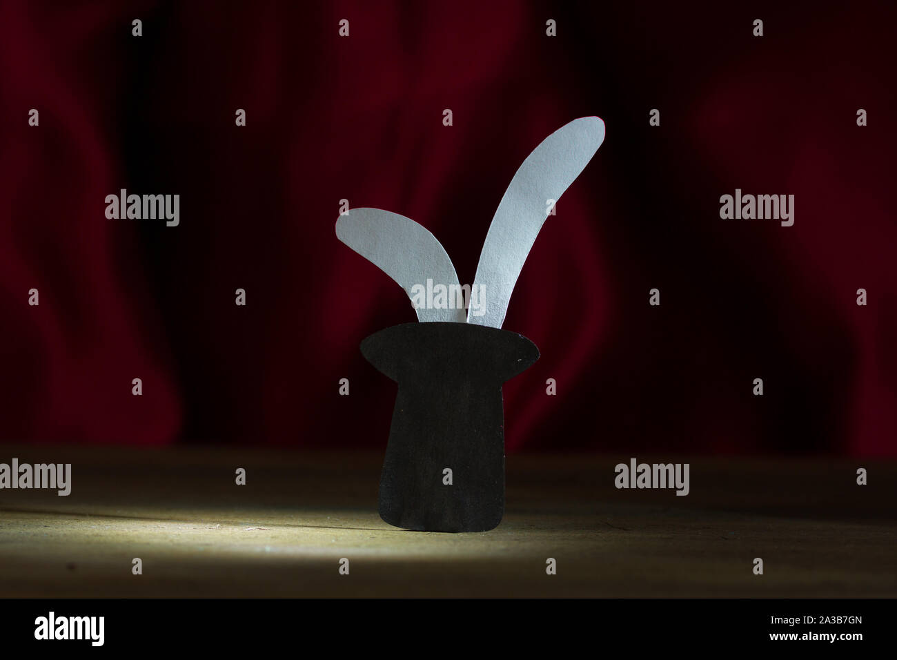 Black magic hat. Red curtains background. Magic concept Stock Photo - Alamy