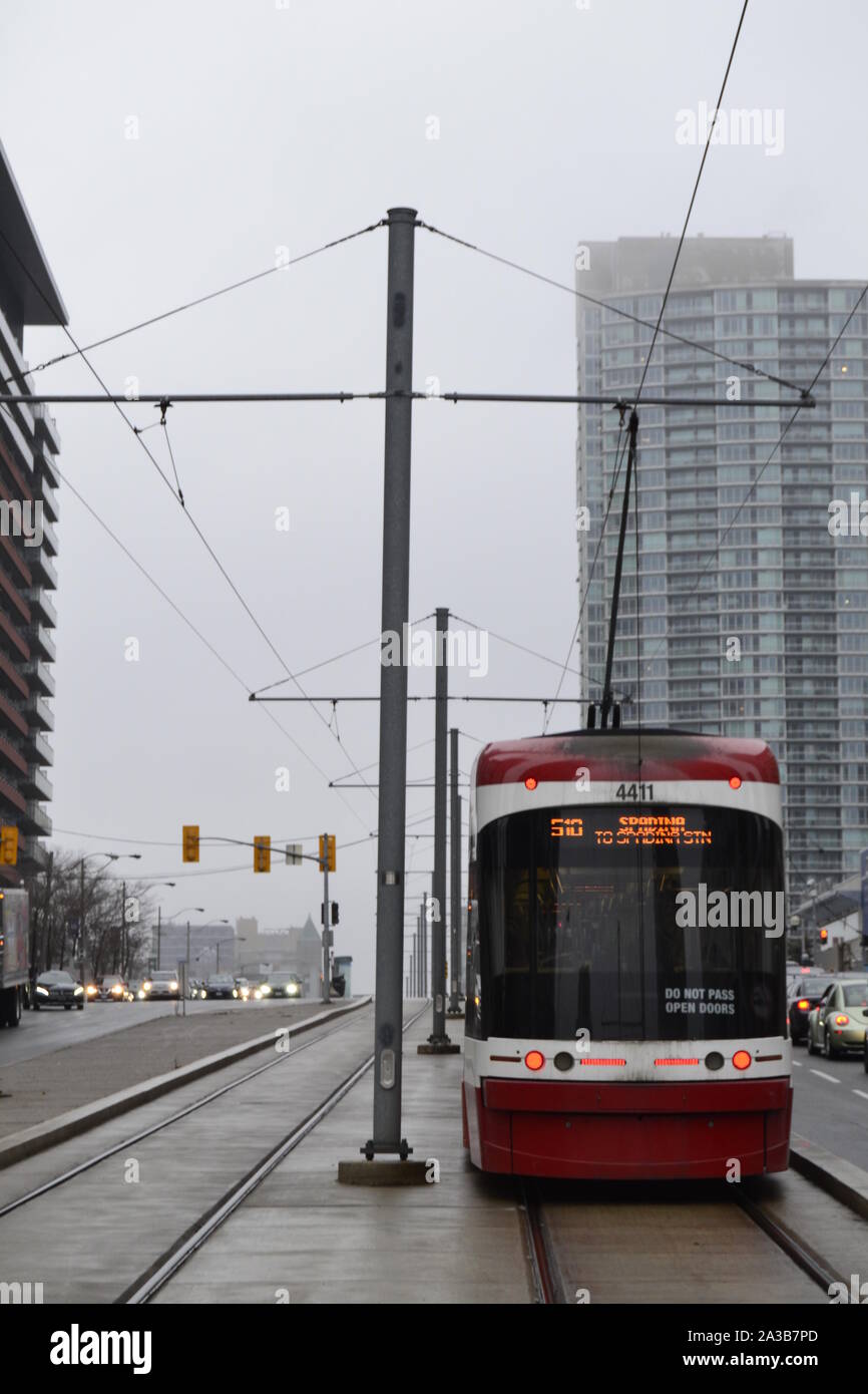 Toronto tram on a cloudy day with skyscrapers in the background Stock ...