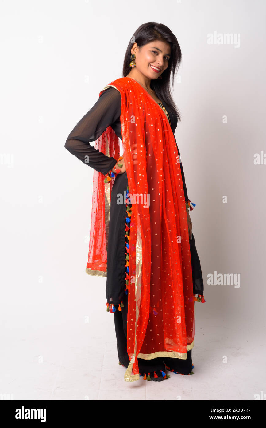 Full body shot of happy young Persian woman smiling in traditional ...