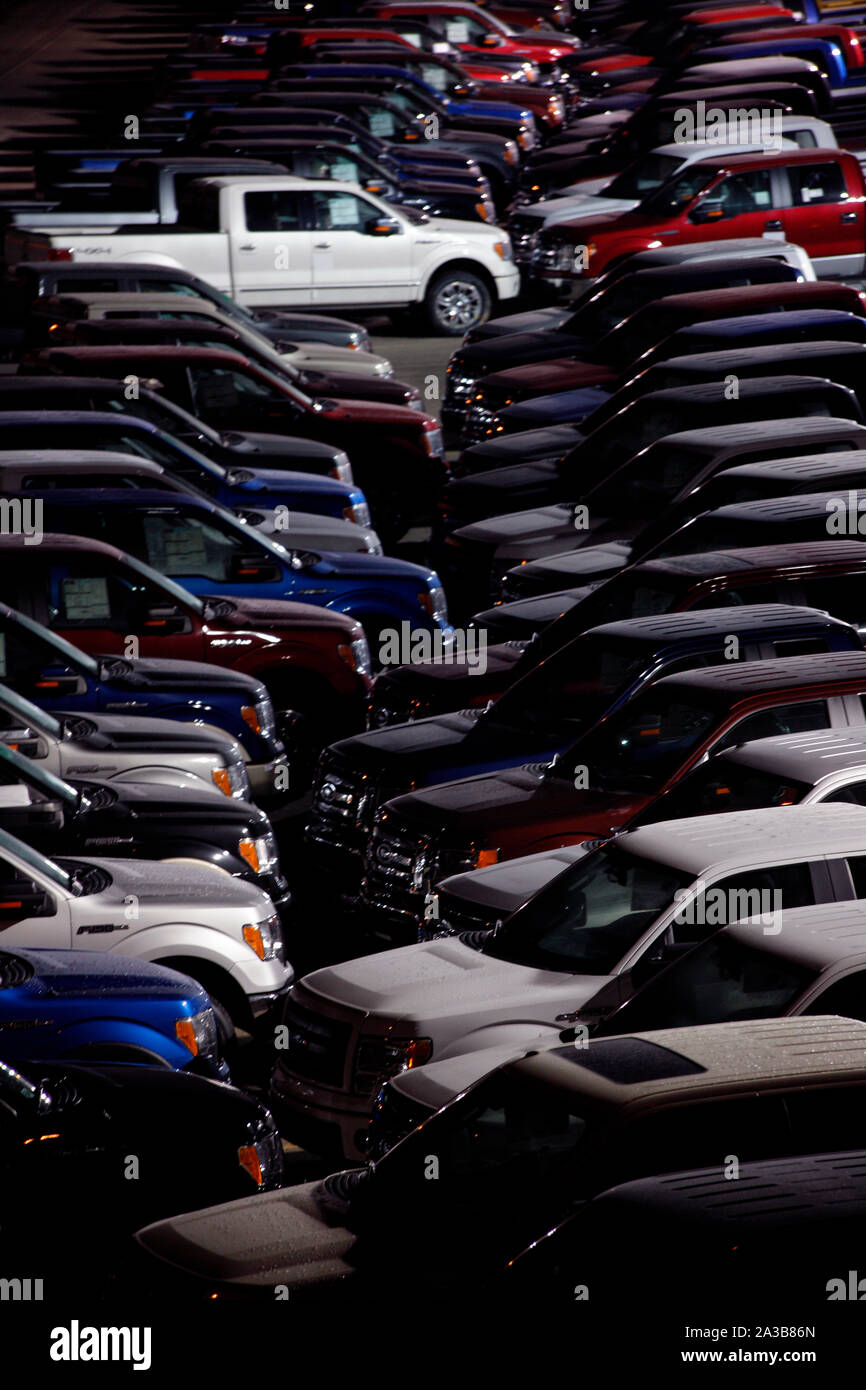 New SUV's and Pickup trucks are sitting on a storage lot at the Ford ...