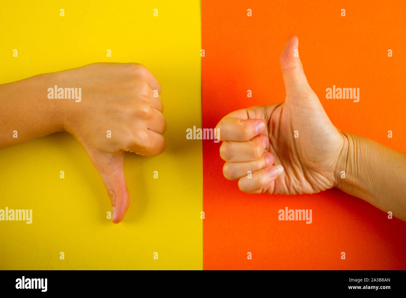 Like and dislike hands on colorful background Stock Photo - Alamy