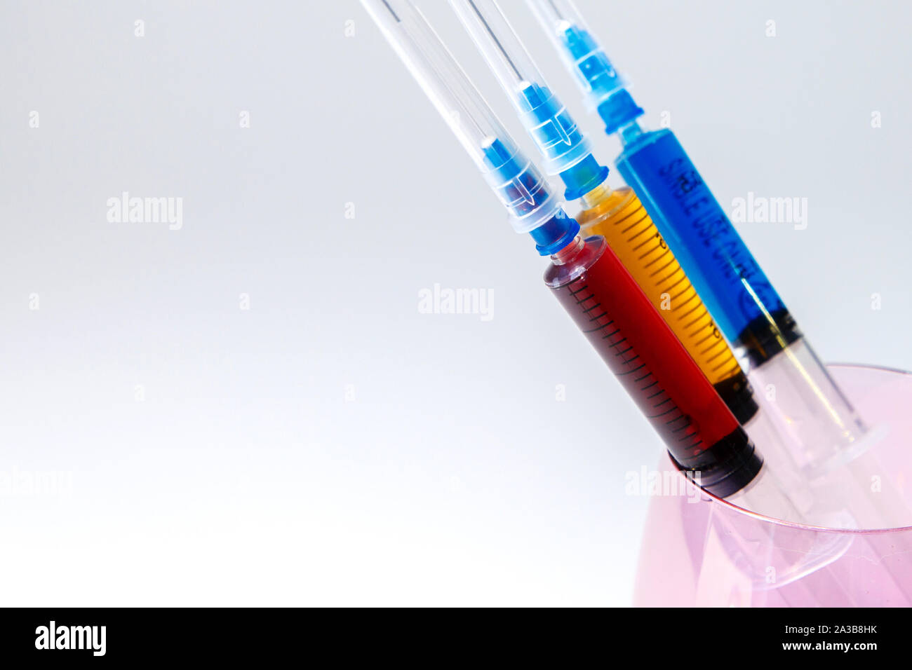 A set of medical syringes with color injections for cosmetology. The ...