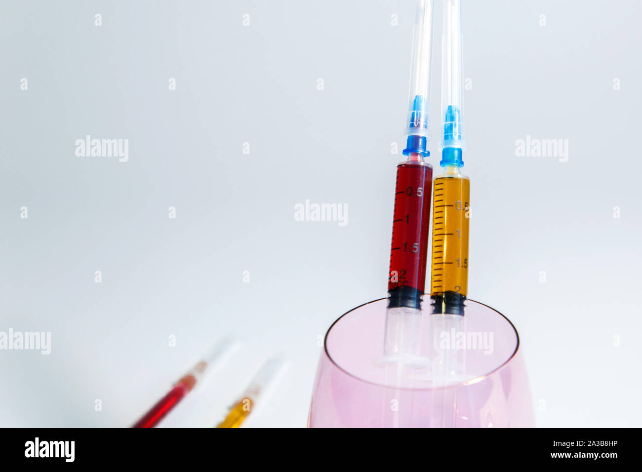A set of medical syringes with color injections for cosmetology. The ...