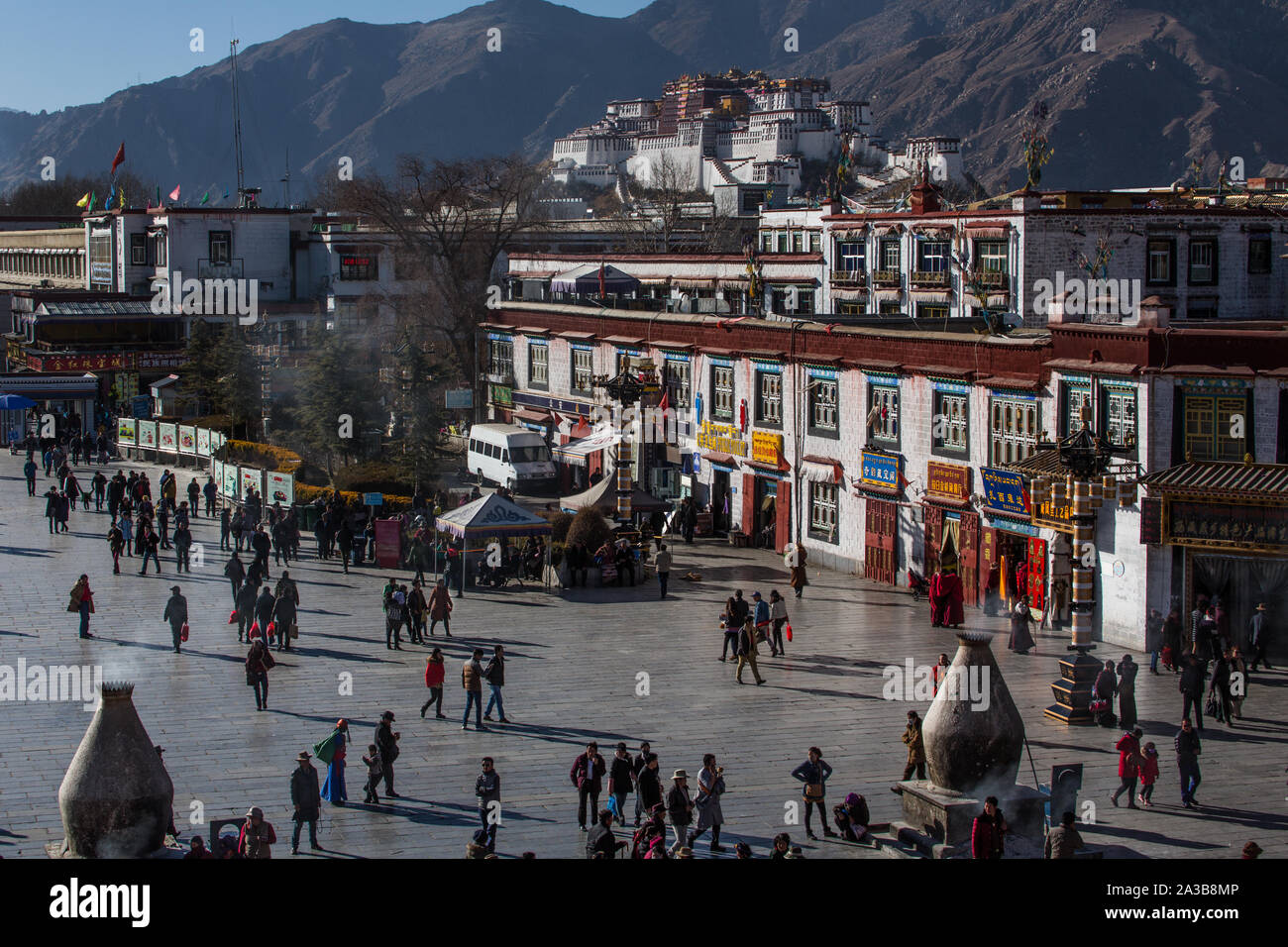 Tibetan pilgrims circumambulate around the Jokhang Temple in Barkhor ...