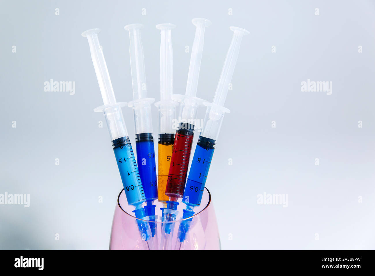 A set of medical syringes with color injections for cosmetology. The ...