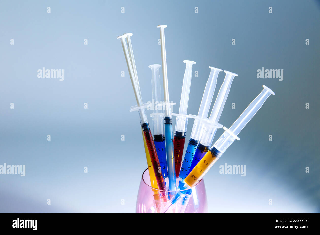 A set of medical syringes with color injections for cosmetology. The ...