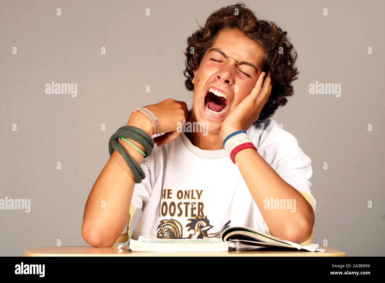 secondary school, teenaged student yawning Stock Photo - Alamy