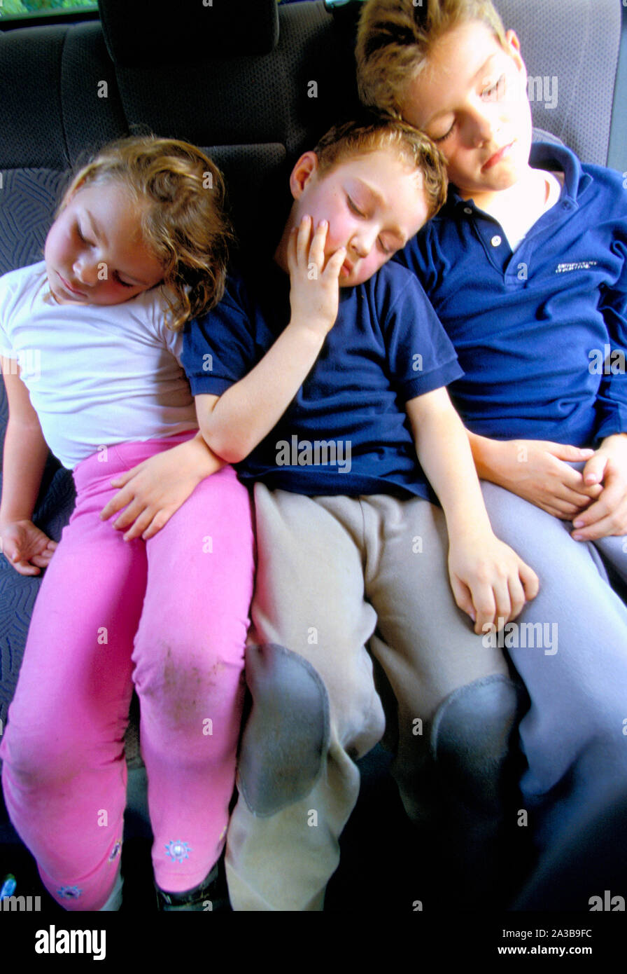 children sleeping in a car Stock Photo - Alamy