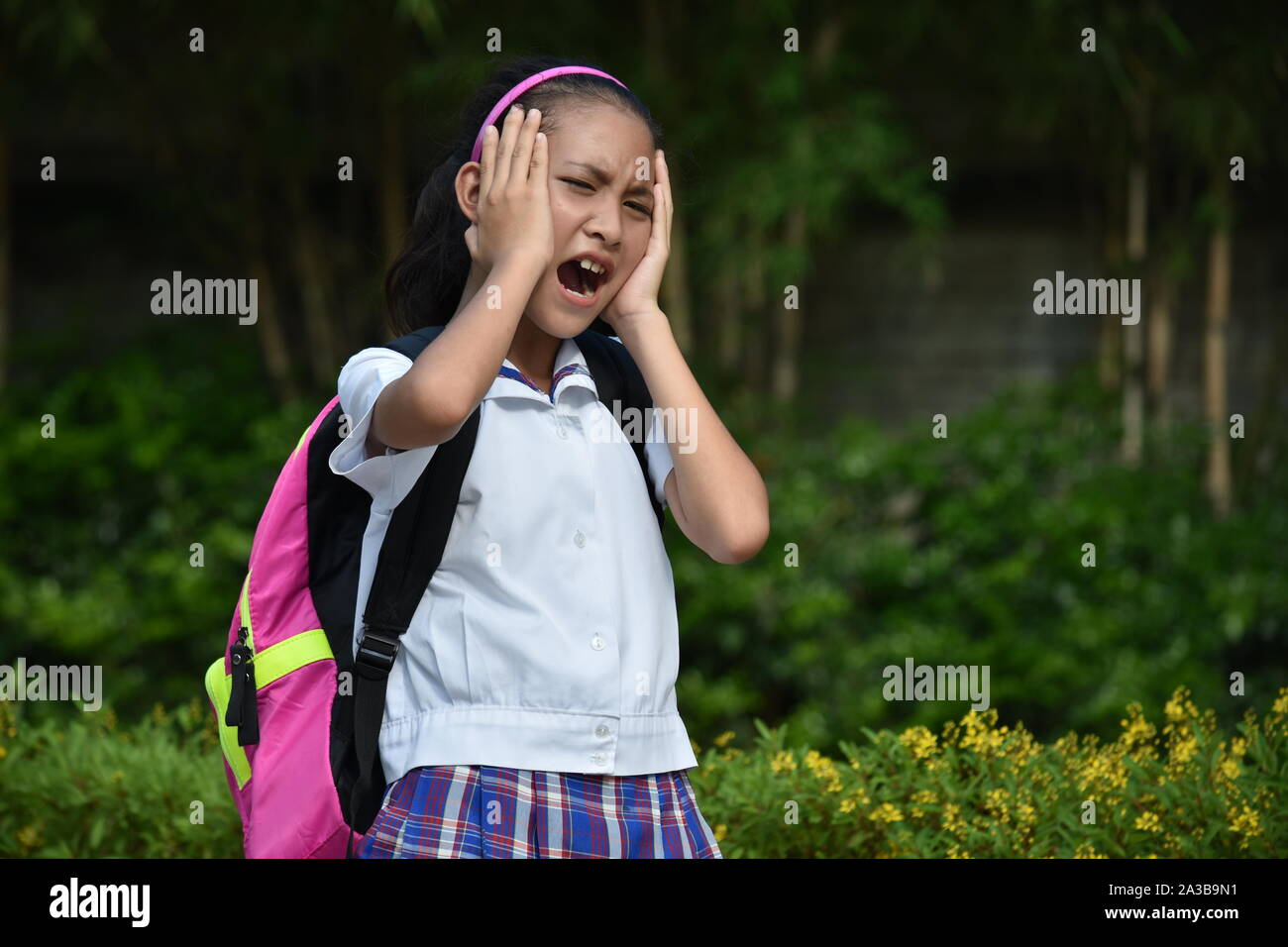 Female Student Under Stress Wearing Uniform Stock Photo - Alamy