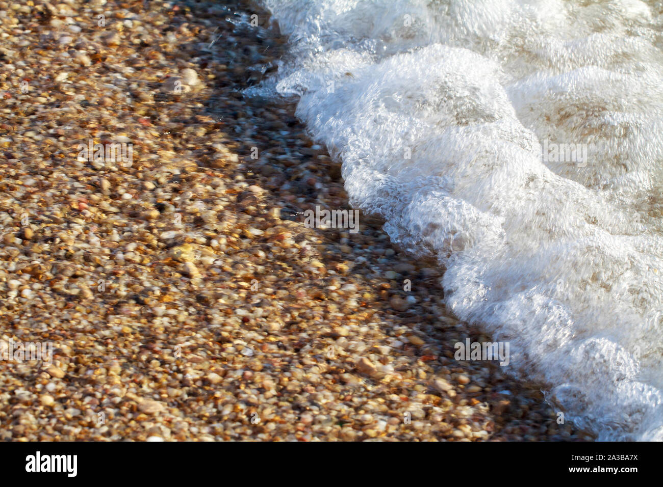 sea pebbles colored granite on the beach background stones. The shore ...
