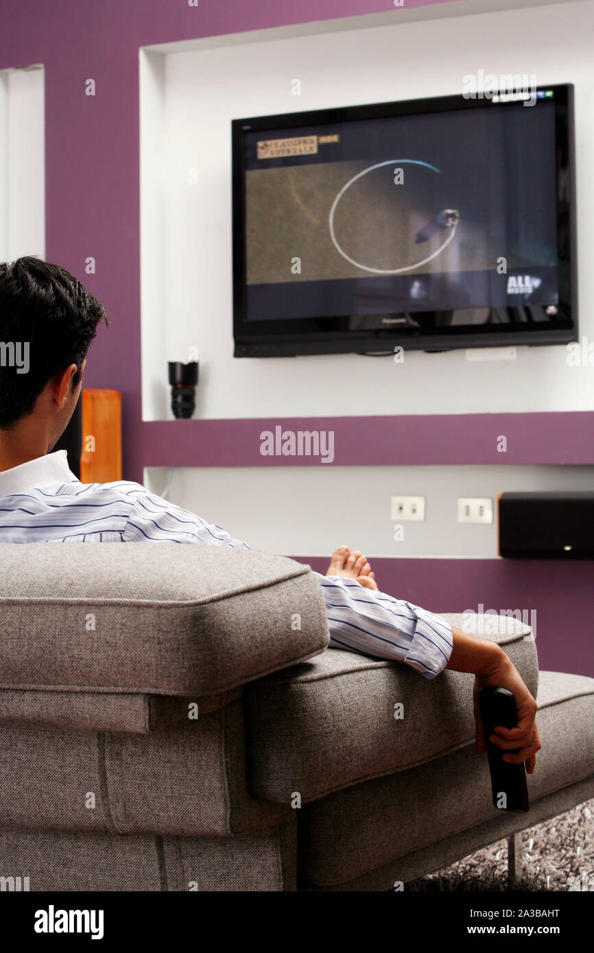 man watching television Stock Photo - Alamy