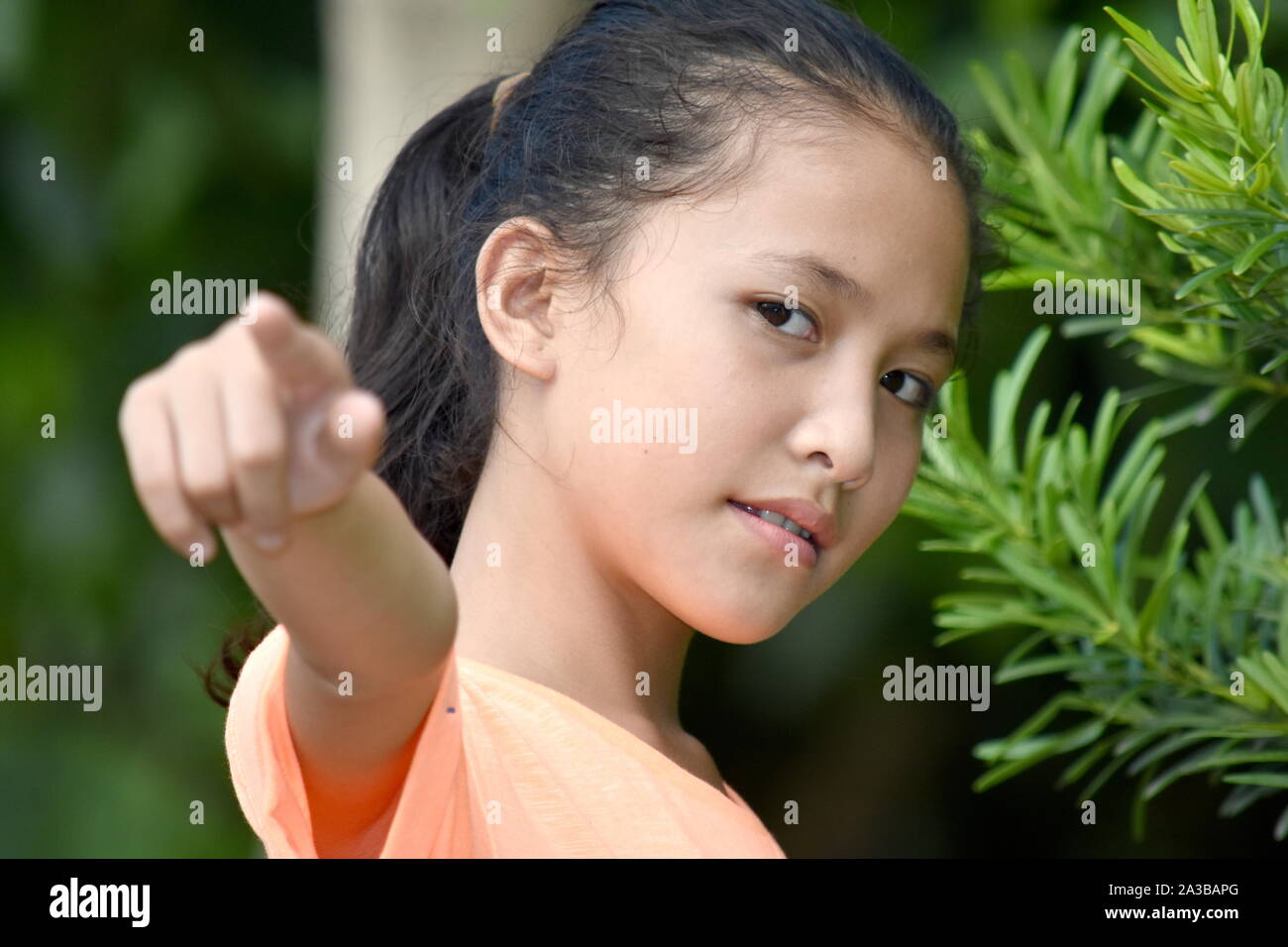 An A Filipina Girl Pointing Stock Photo - Alamy