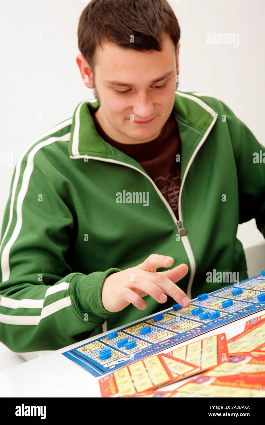 teenager playing bingo Stock Photo - Alamy