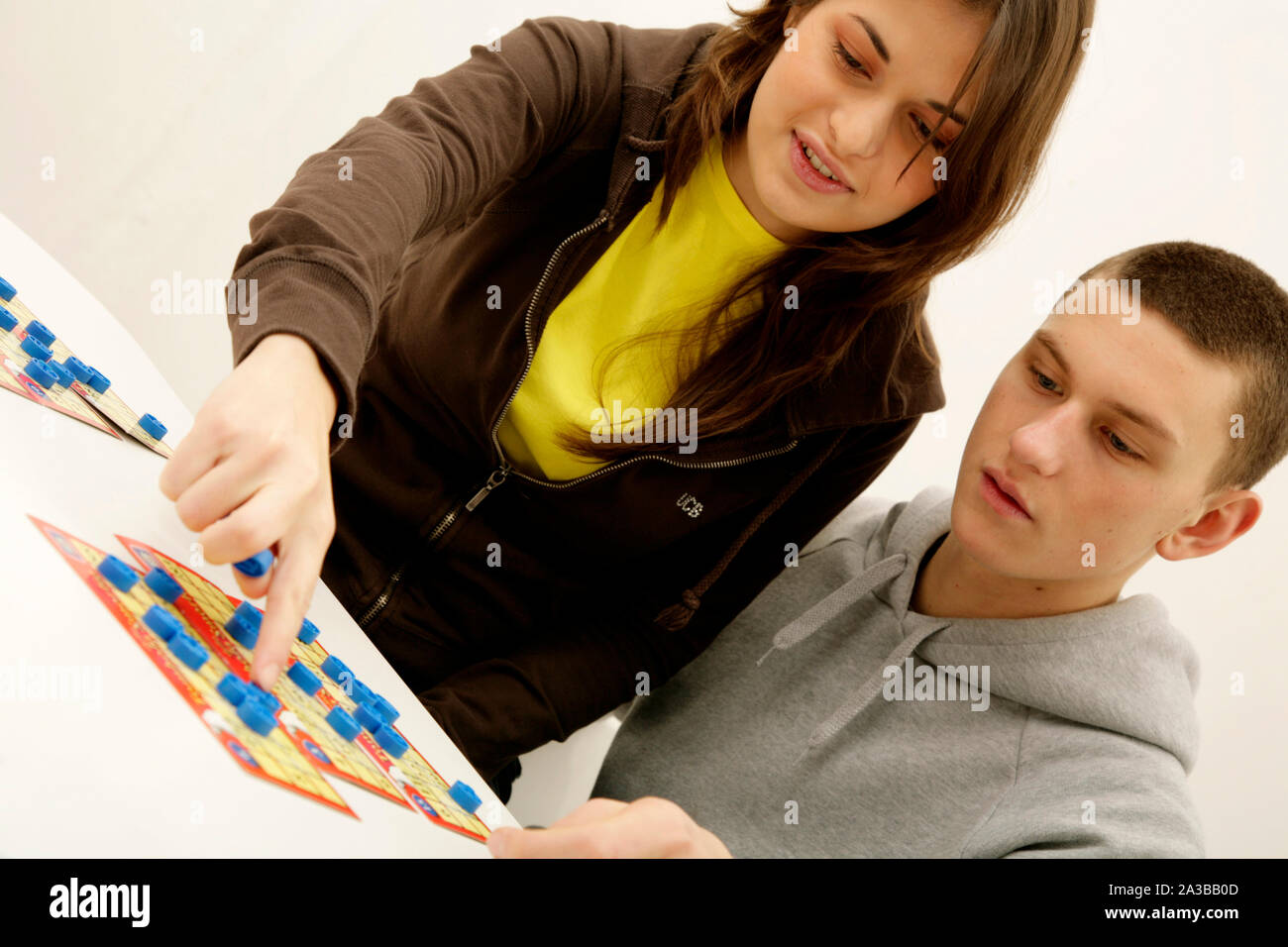 teenagers playing bingo Stock Photo - Alamy