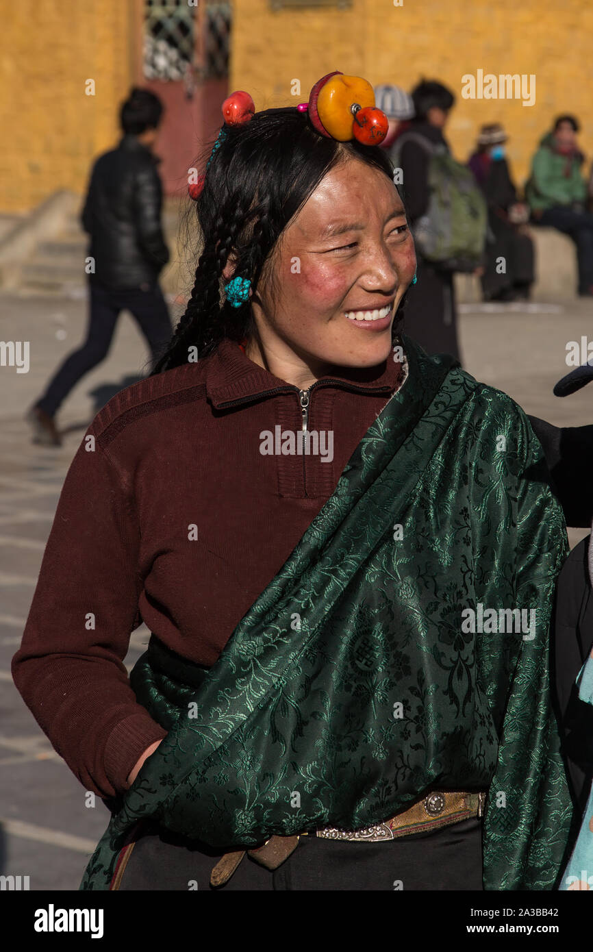 A Khamba Tibetan woman from the Kham region of eastern Tibet with her ...