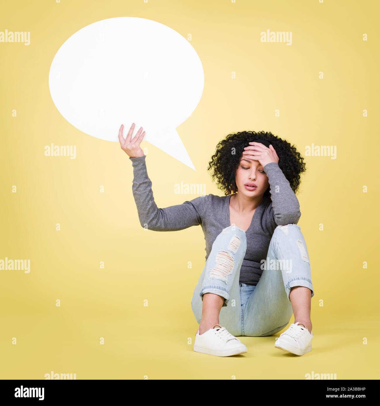 Desperate girl holding a blank white sign board Stock Photo - Alamy