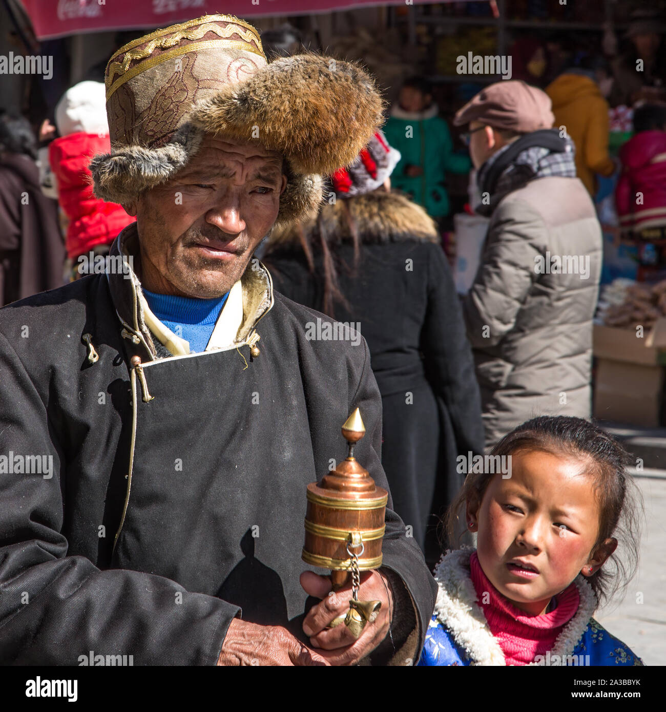 A Khamba grandfather with his golden thread hat and Buddhist prayer ...