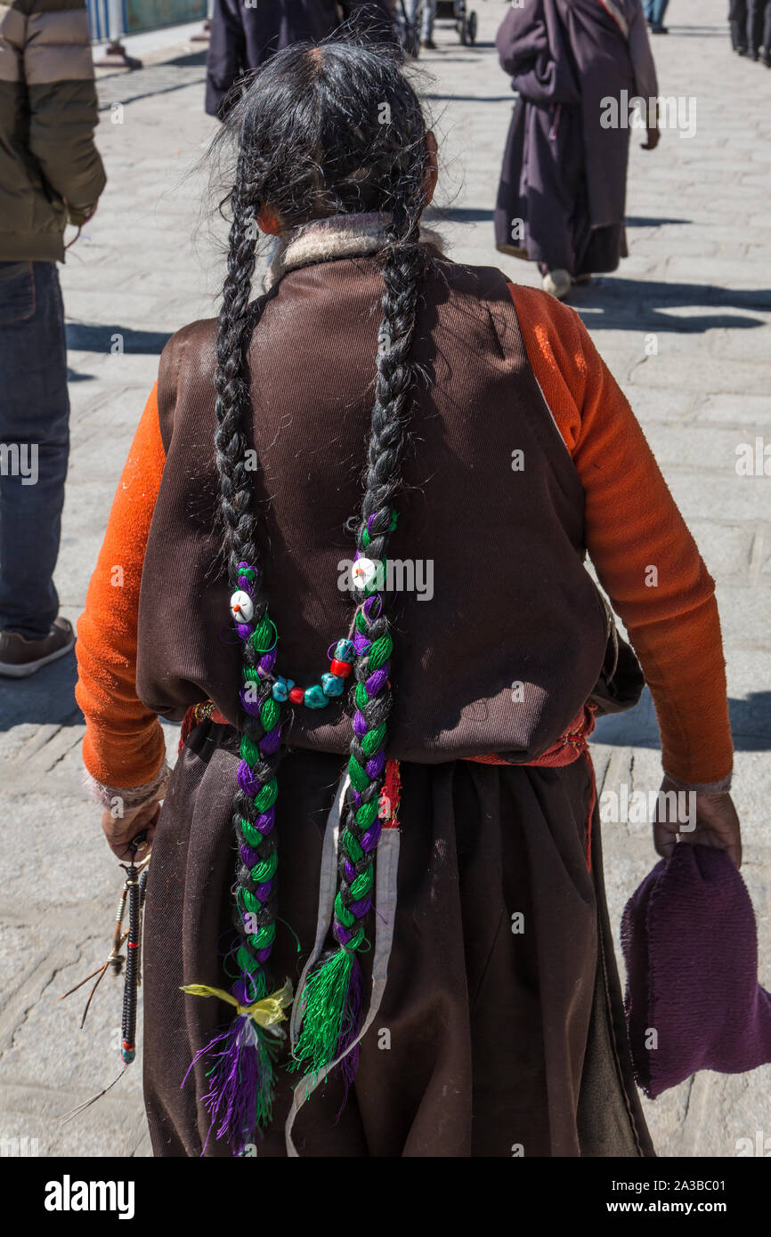 A Khamba Tibetan woman from the Kham region of Tibet on a pilgrimage to ...