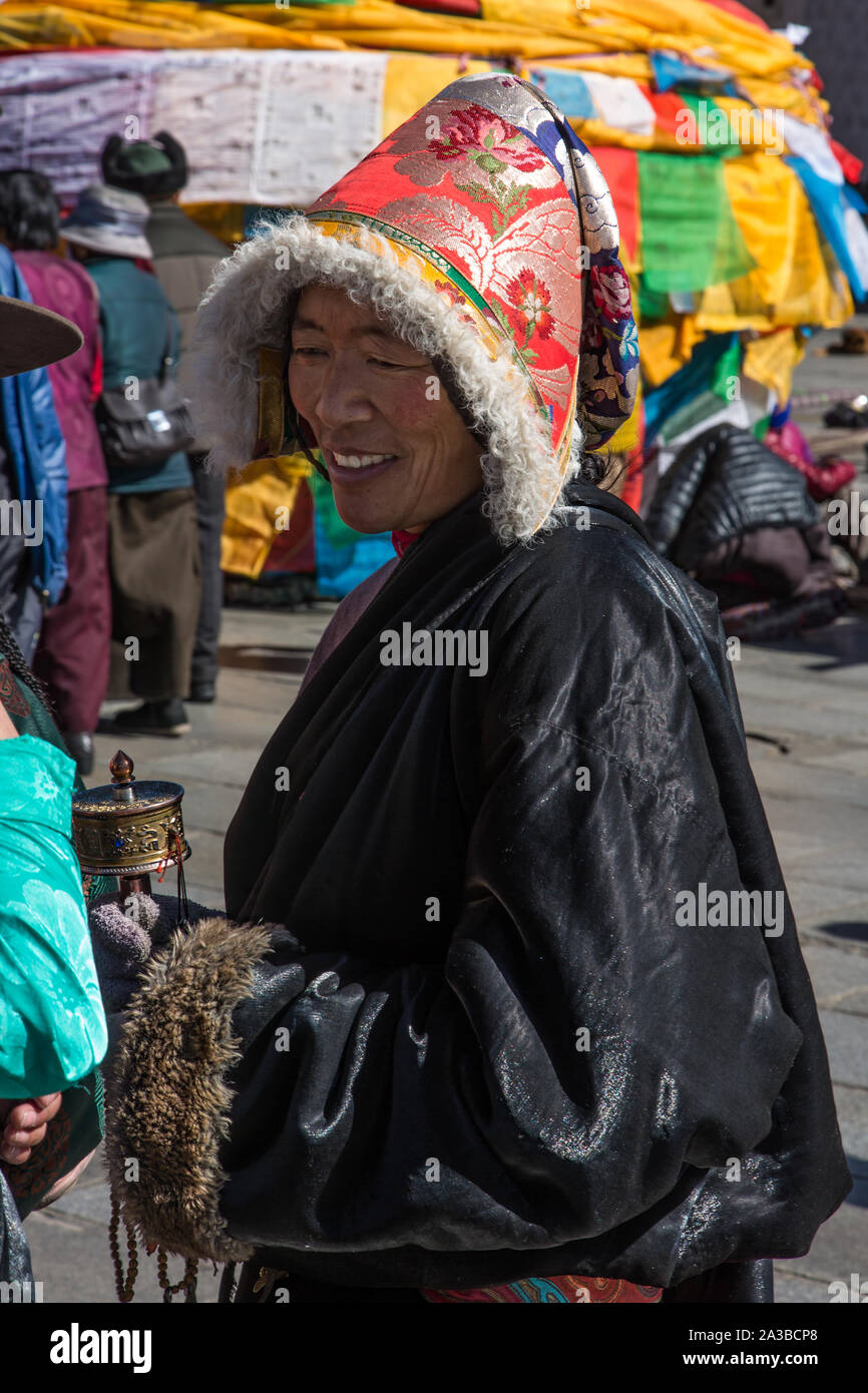A Khamba Tibetan woman pilgrim from the Kham region of eastern Tibet ...