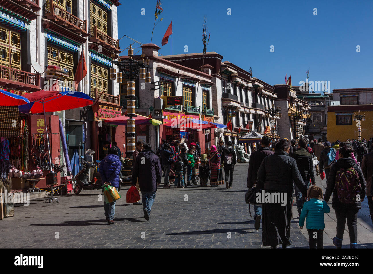 Tibetan Buddhist pilgrims walking the kora or circumambulation route ...