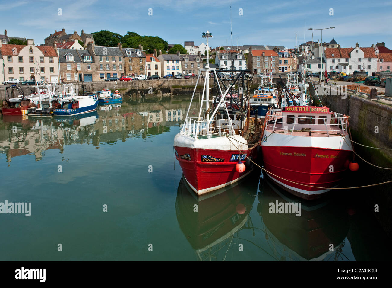 Fishing boats moored in Pittenweem harbour. Fife, Scotland Stock Photo ...