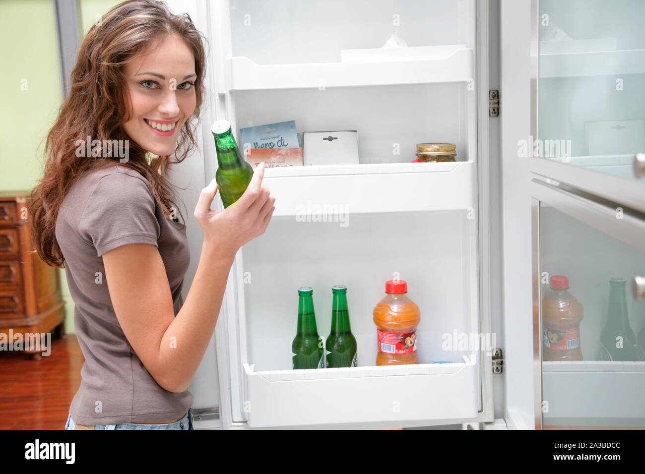 woman and refrigerator Stock Photo - Alamy